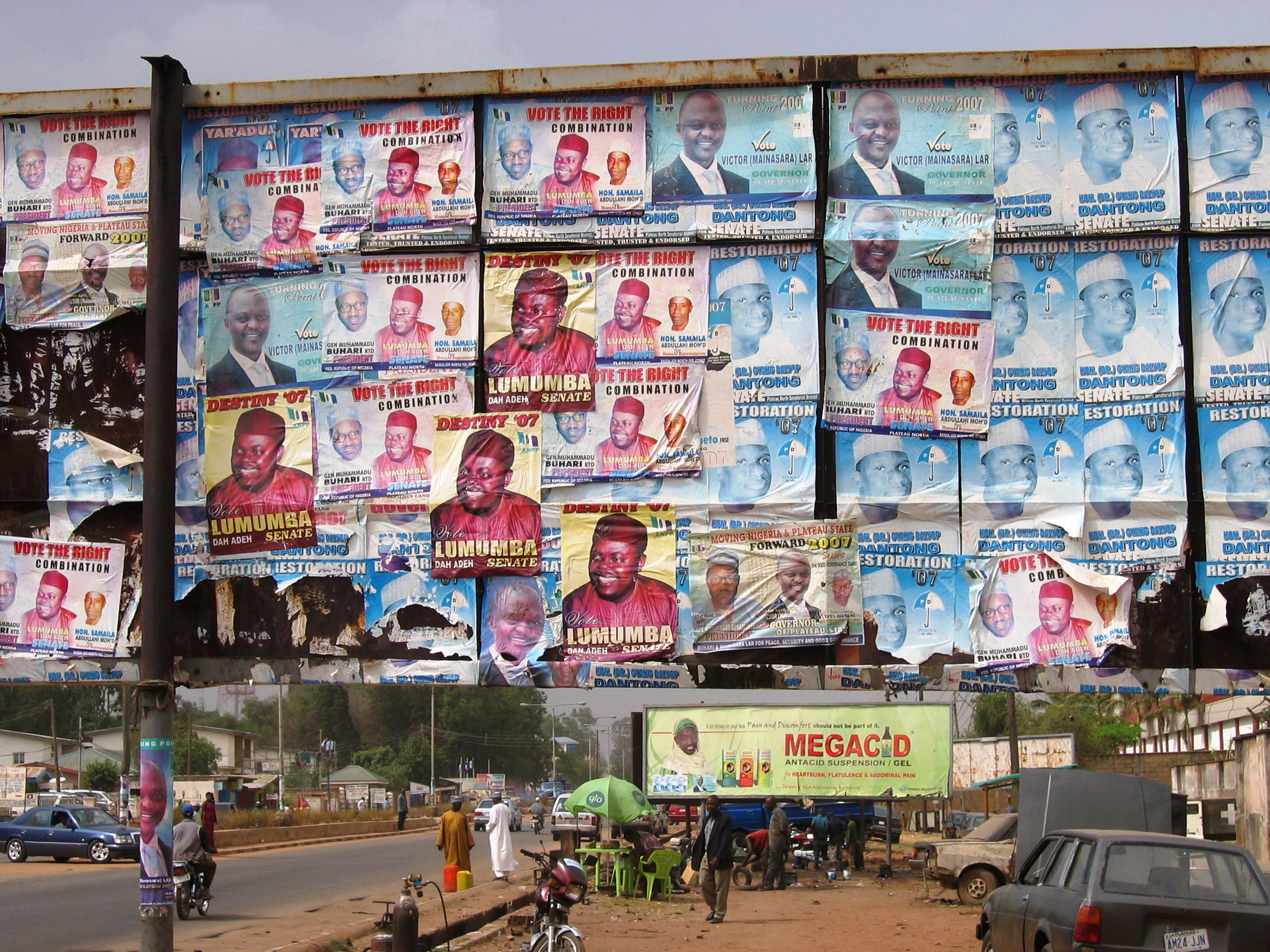 One of the billboards in the town plastered with campaign posters for ...