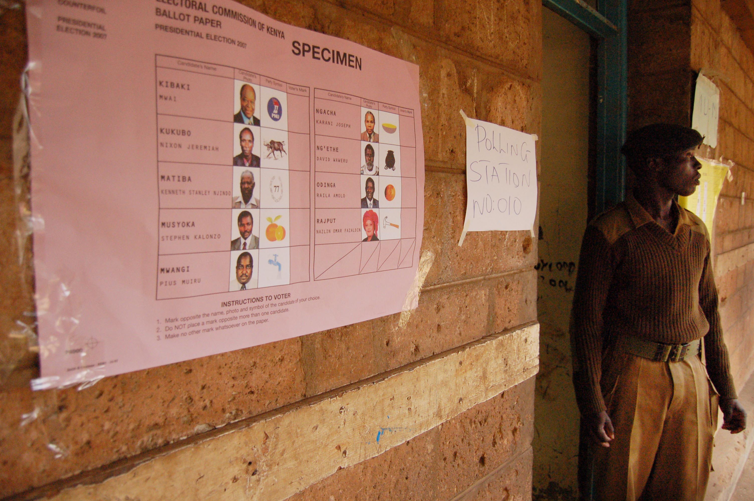 A national youth service guard mans one of the polling stations in ...