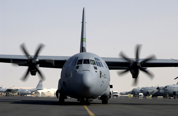 A C-130 Hercules taxis on a ramp. Aircraft such as these are supporting ...