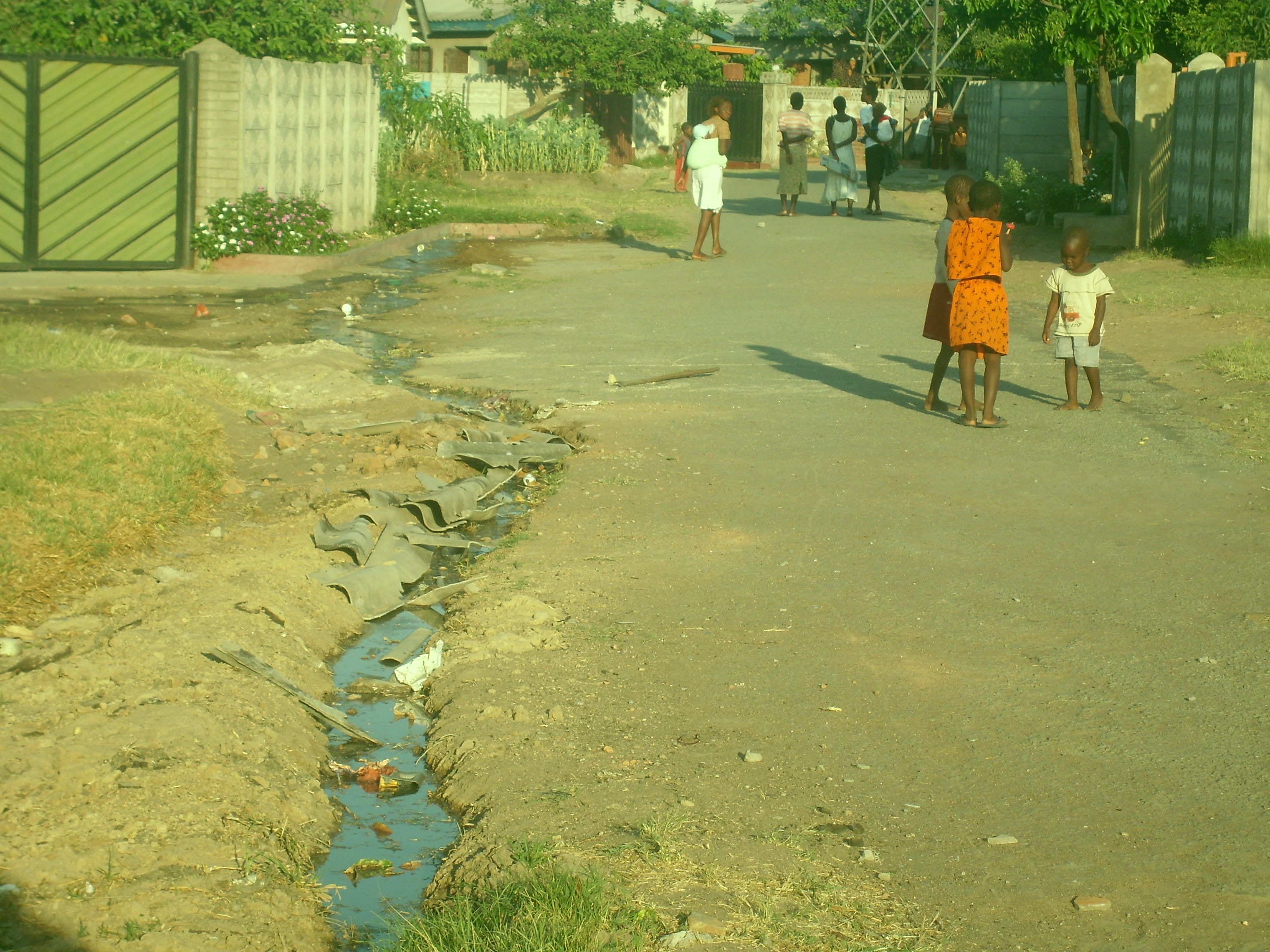 Children Play Next To An Open Sewer In The Capital Harare Sant children-play-next-to-an-open-sewer-in-the-capital-harare-sant
