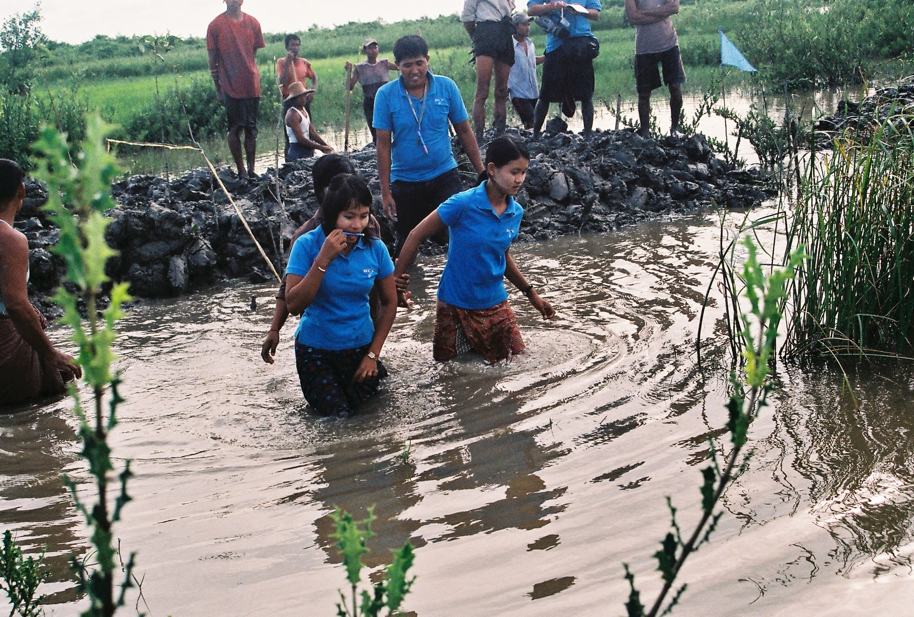 Wading barefoot through thigh-high water | Environment and Disasters ...