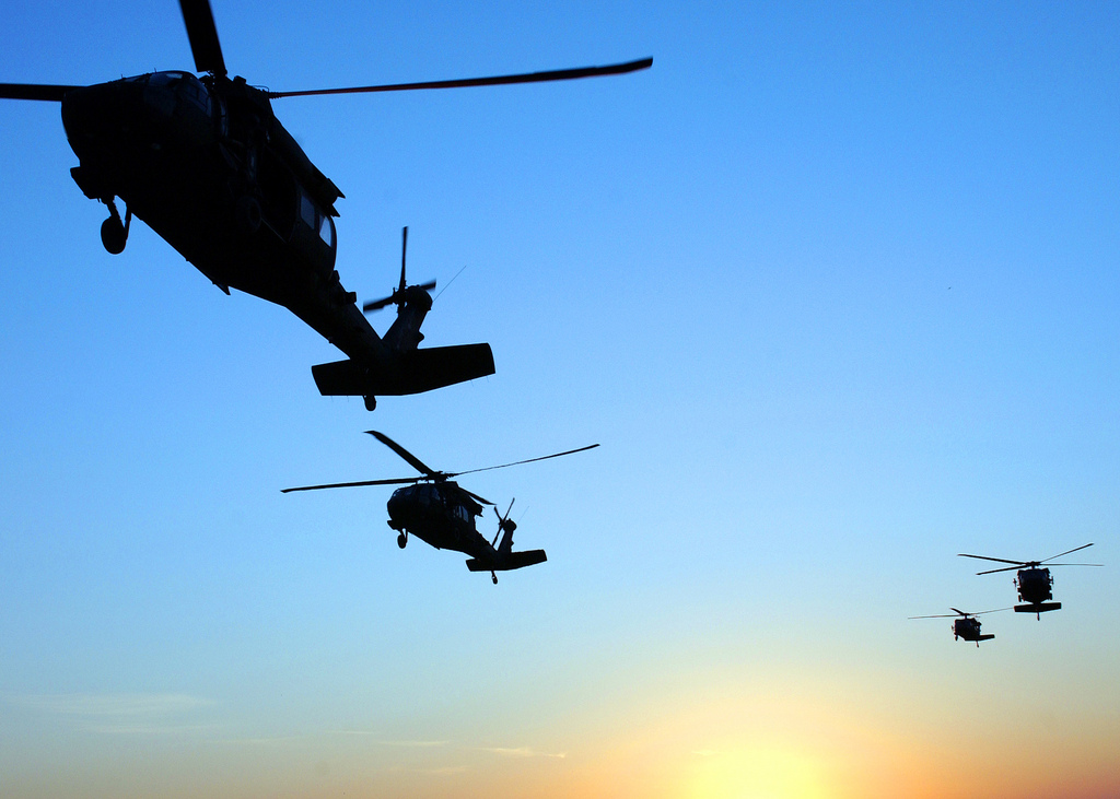 Four US Army UH-60 Blackhawk helicopters land, pick up and transport US ...