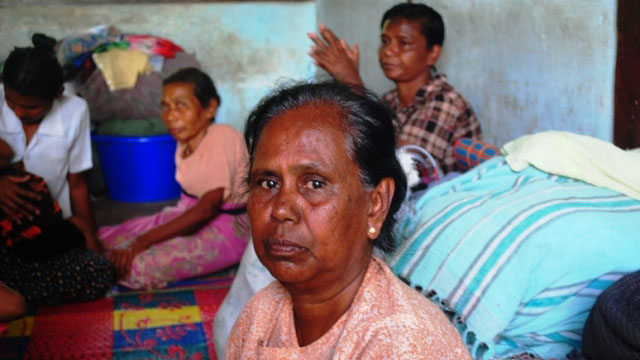 A displaced woman takes refuge in a school in Meiktila, central Myanmar ...