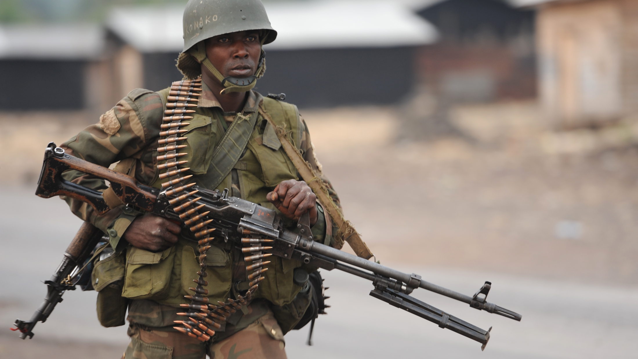 An FARDC soldier on the Kanyaruchinya frontline on the outskirts of the ...