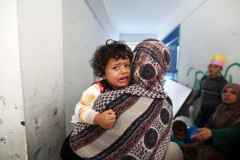 child-crying-hospital-gaza.jpg | Conflict | The New Humanitarian