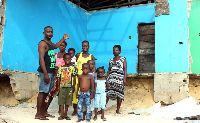 liberia_-_lawrence_and_members_of_his_family_in_front_of_their_reduced ...